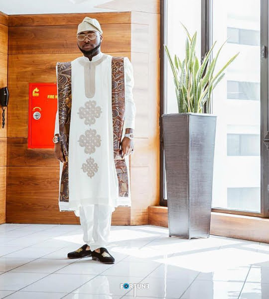 Davido In White Agbada With Brown Damask Detail and Fila Cap – Clipkulture