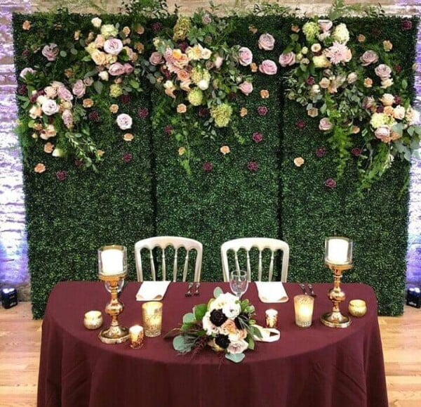 Clipkulture | Romantic Couple Stage With Green Floral Backdrop