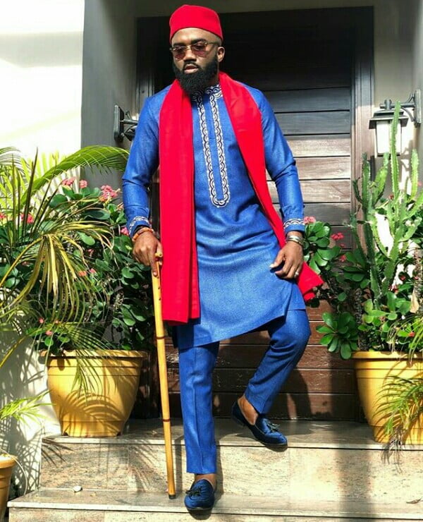 Clipkulture | Noble Igwe In Light Blue Kaftan With Red Cap and Shawl