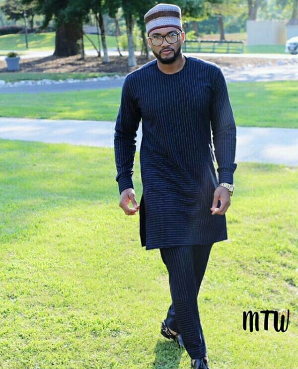 Man In Dark Blue Pin Stripe Kaftan and Tangaran Cap – Clipkulture