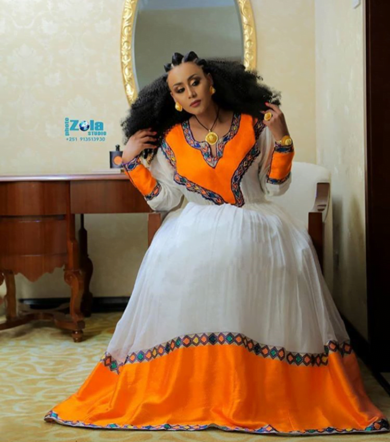 Lady In Beautiful Orange and White Patterned Habesha Kemis, Gold ...